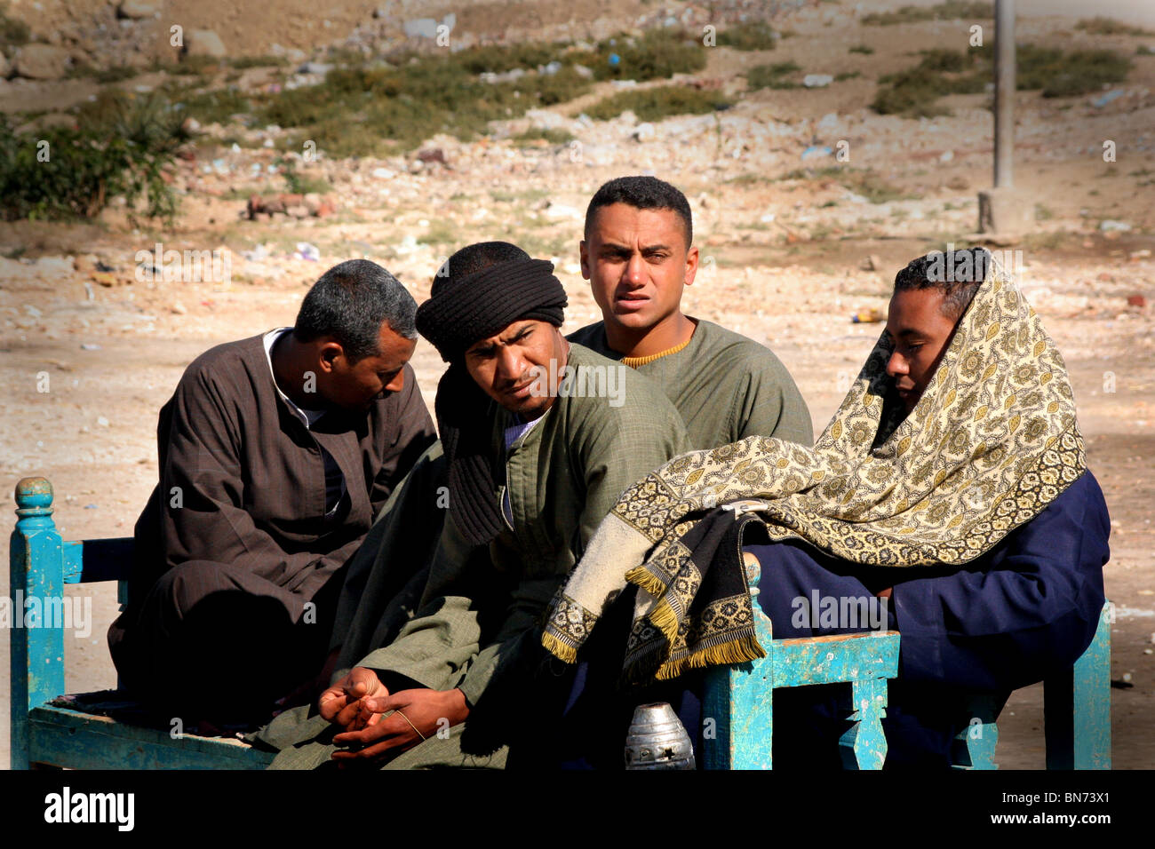 men relaxing on bench Stock Photo - Alamy