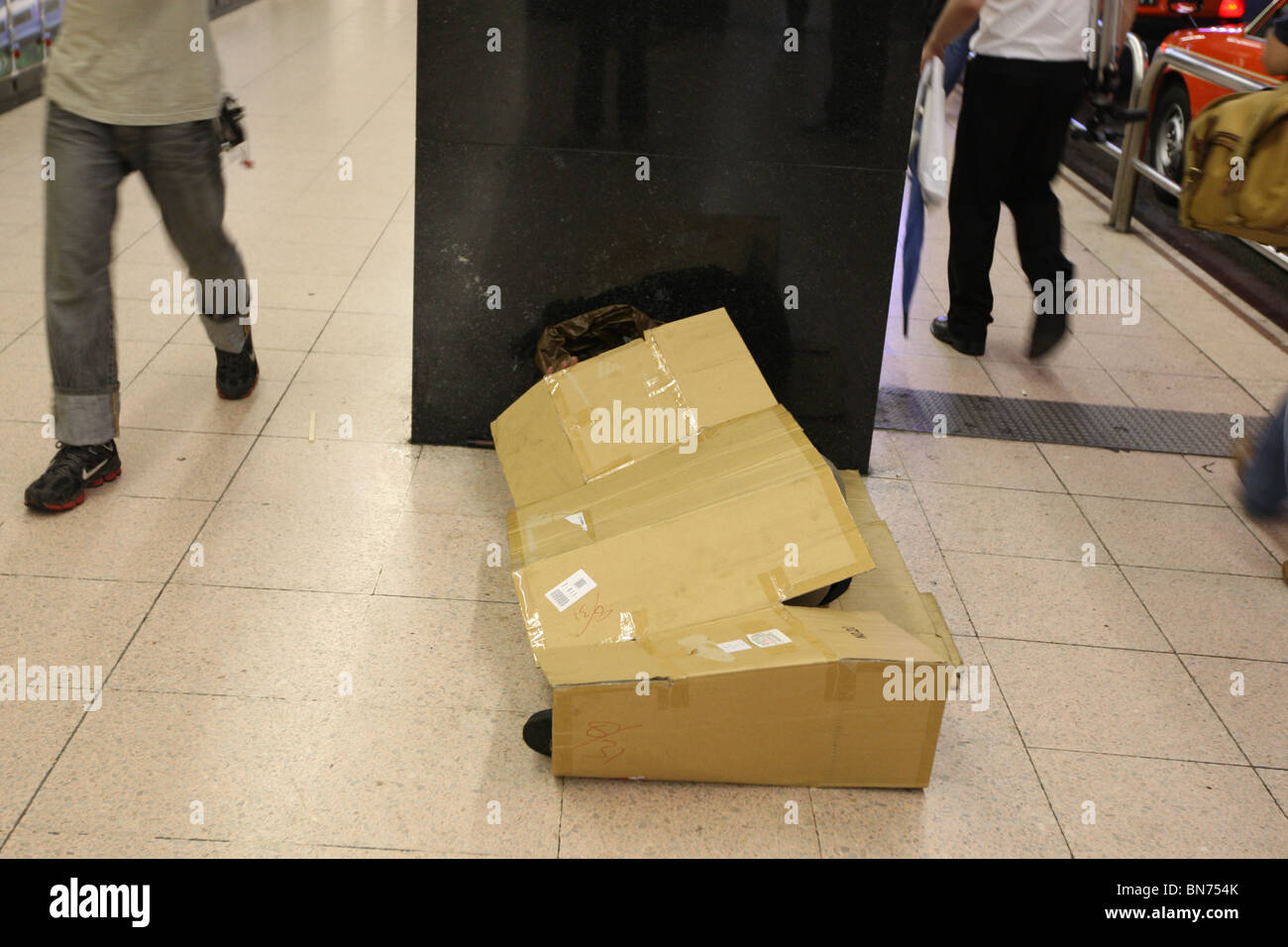 Homeless Men Sleeping Rough In Cardboard Boxes On The Streets Of Tokyo