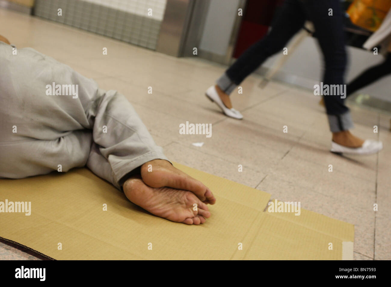 Homeless Men Sleeping Rough In Cardboard Boxes On The Streets Of Tokyo