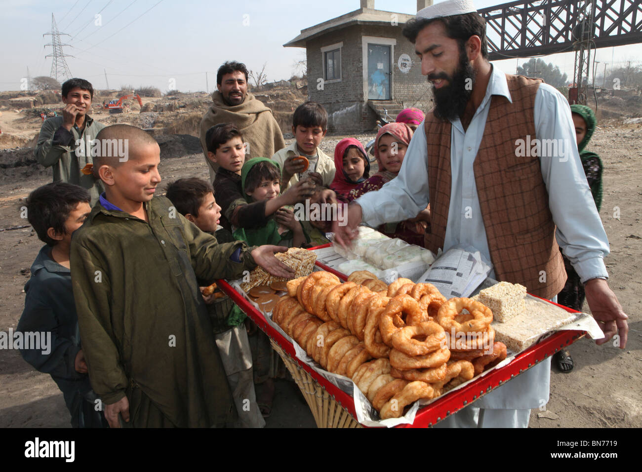 Pakistani children buying sweets Stock Photo - Alamy
