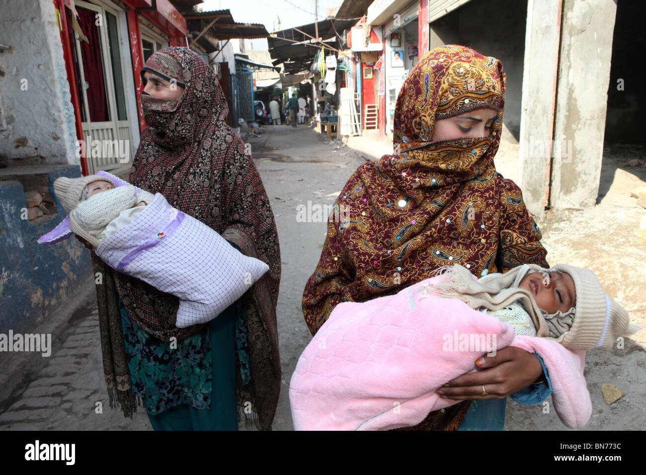 Pakistani mothers and their babies Stock Photo - Alamy
