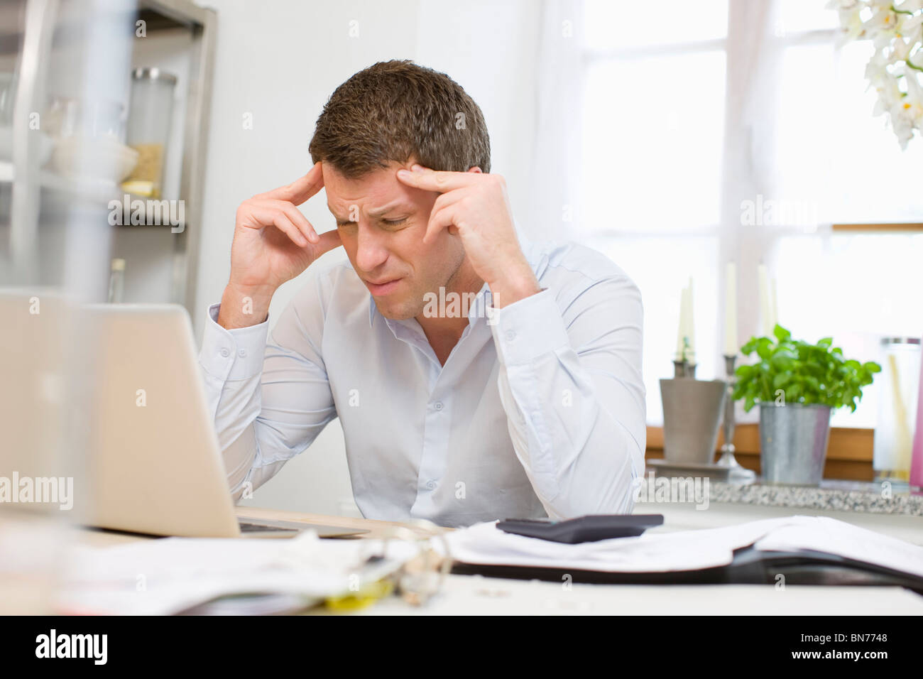 Man concentrating on a problem Stock Photo - Alamy