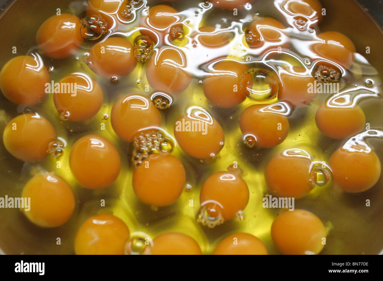 raw uncooked eggs in a bowl Stock Photo - Alamy