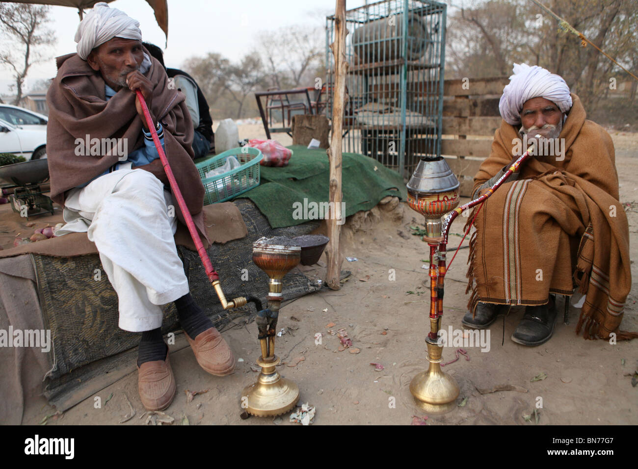 Smoking waterpipe in Pakistan Stock Photo - Alamy