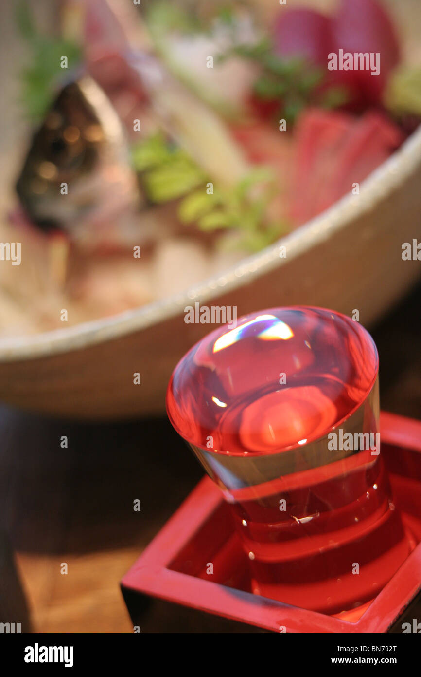 Seafood sashimi and a glass of sake in the 'Sasano' izakaya restaurant ...