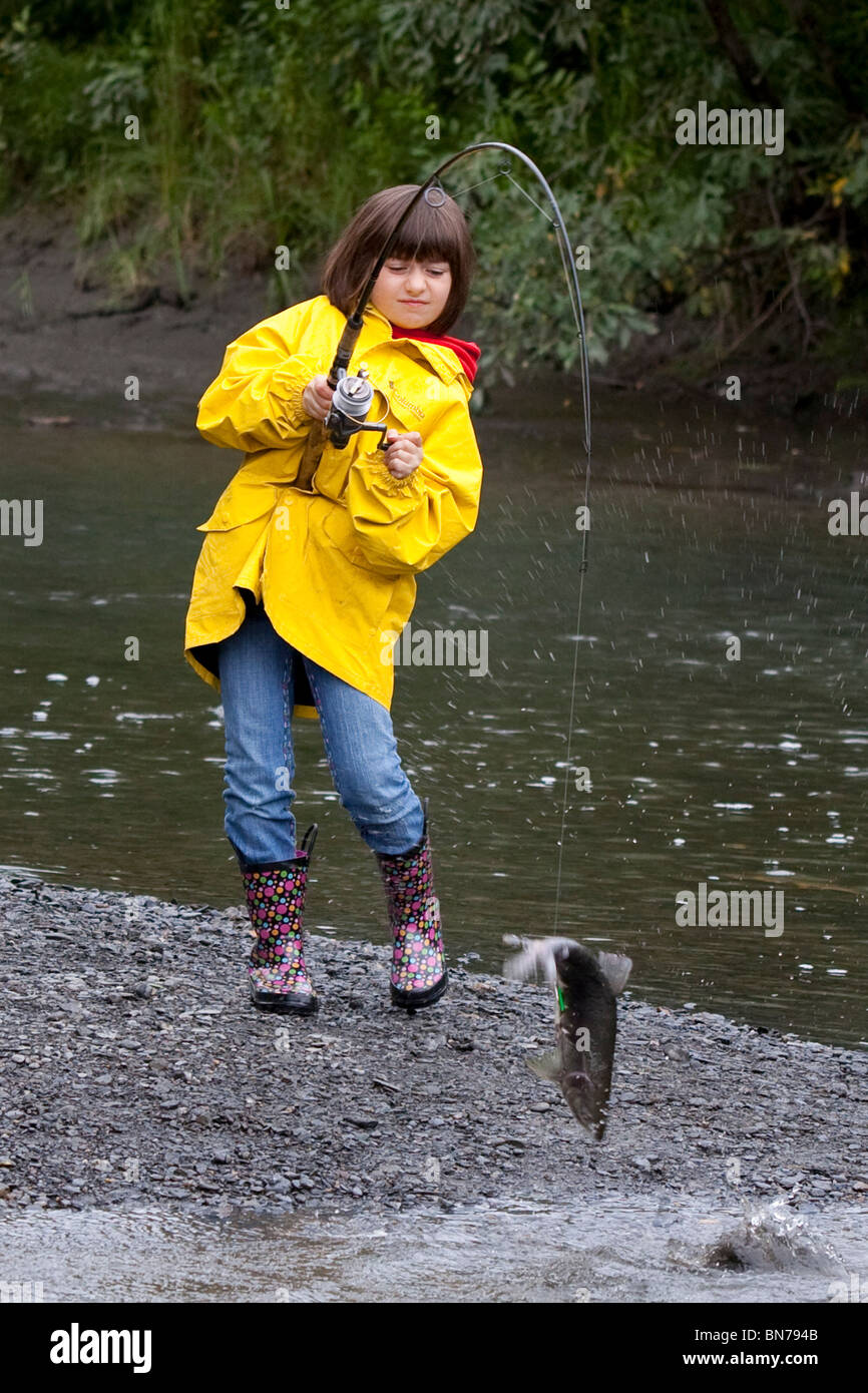 Young girl spin fishing on Ingram Creek reels in a Pink Salmon, Alaska ...
