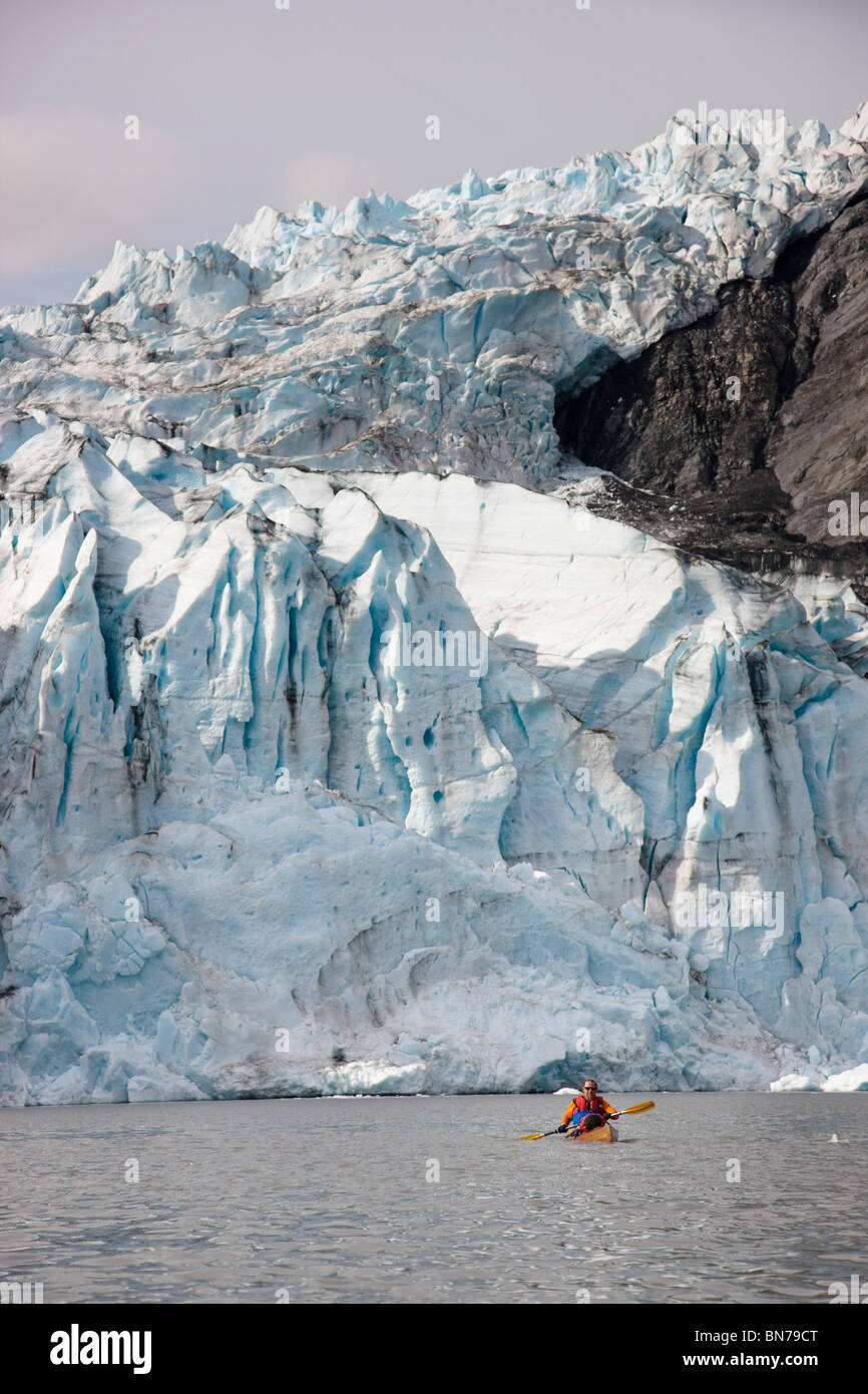 Man kayaking in Shoup Bay with Shoup Glacier in the background, Shoup ...