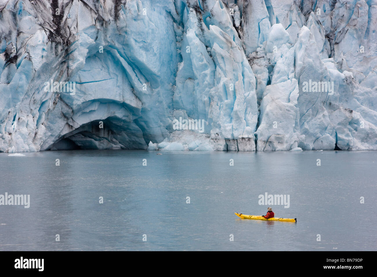 Man kayaking in Shoup Bay with Shoup Glacier in the background, Shoup ...