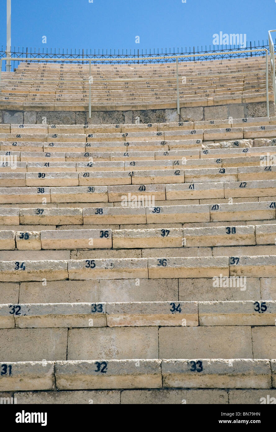 Numbered seating at the amphitheater in Caesarea, Israel Stock Photo ...