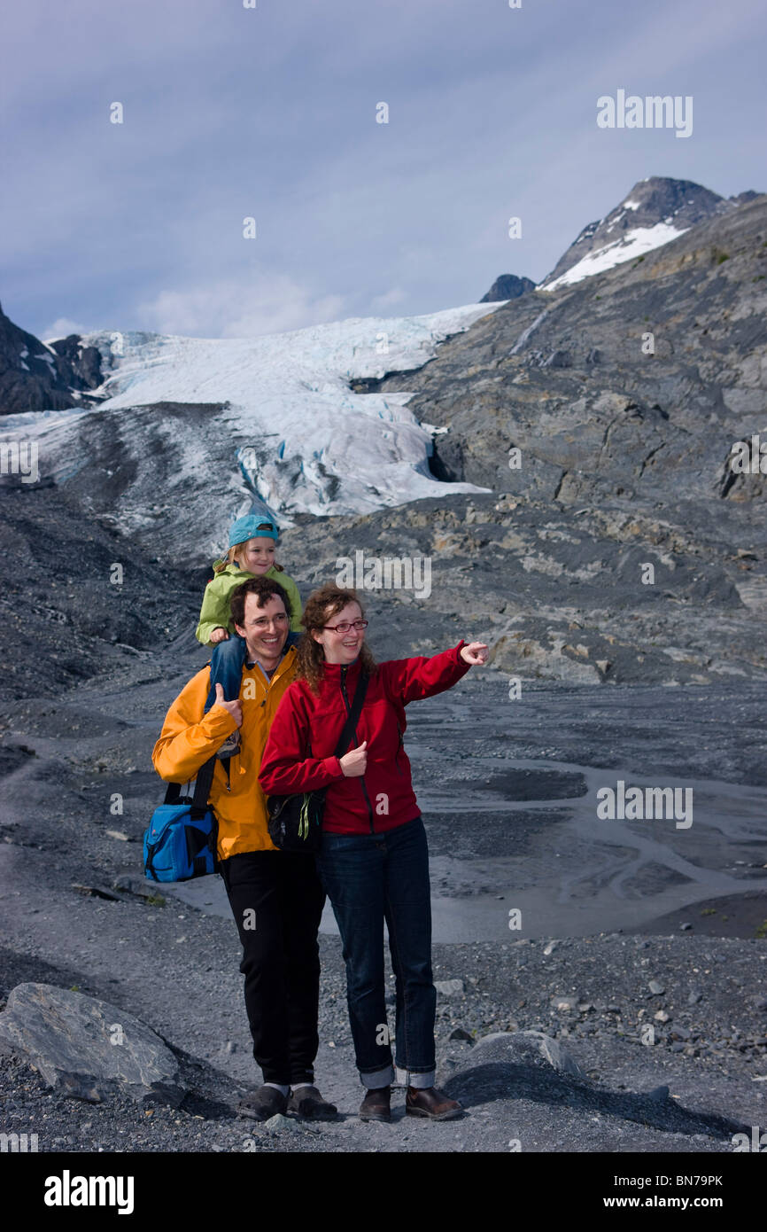 Family hiking on a path in front of the Worthington Glacier, Chugach ...