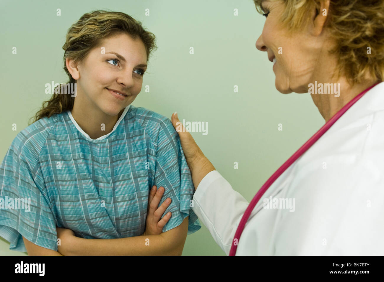 Patient smiling with relief while being reassured with good news Stock ...
