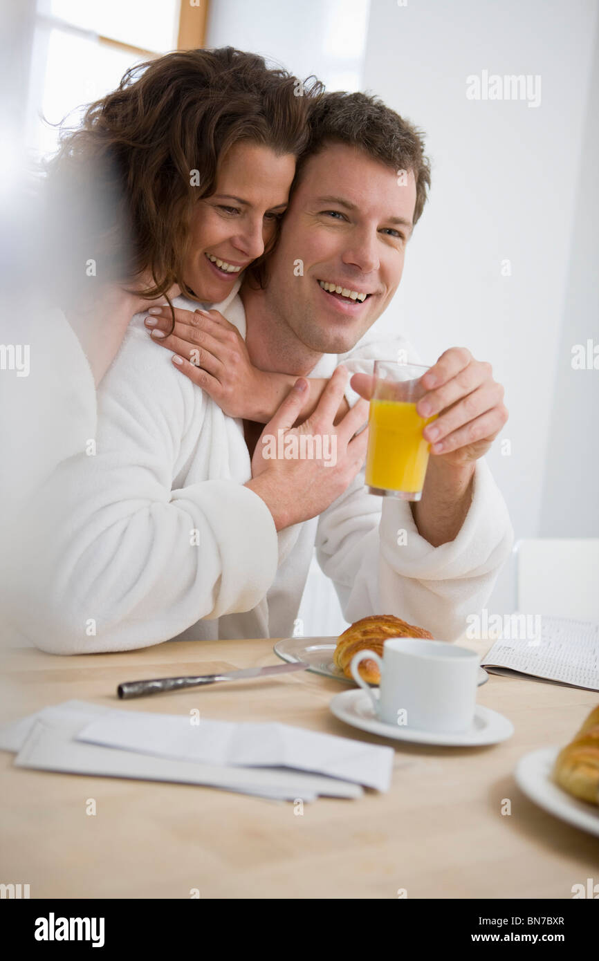 Loving couple having breakfast Stock Photo - Alamy