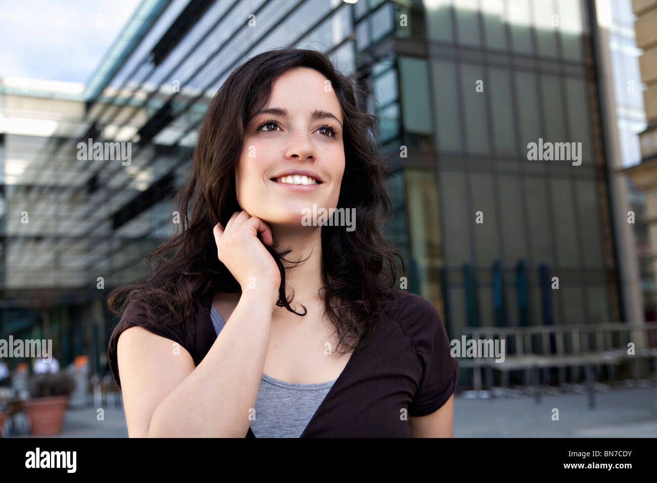 Young woman looking interested Stock Photo - Alamy