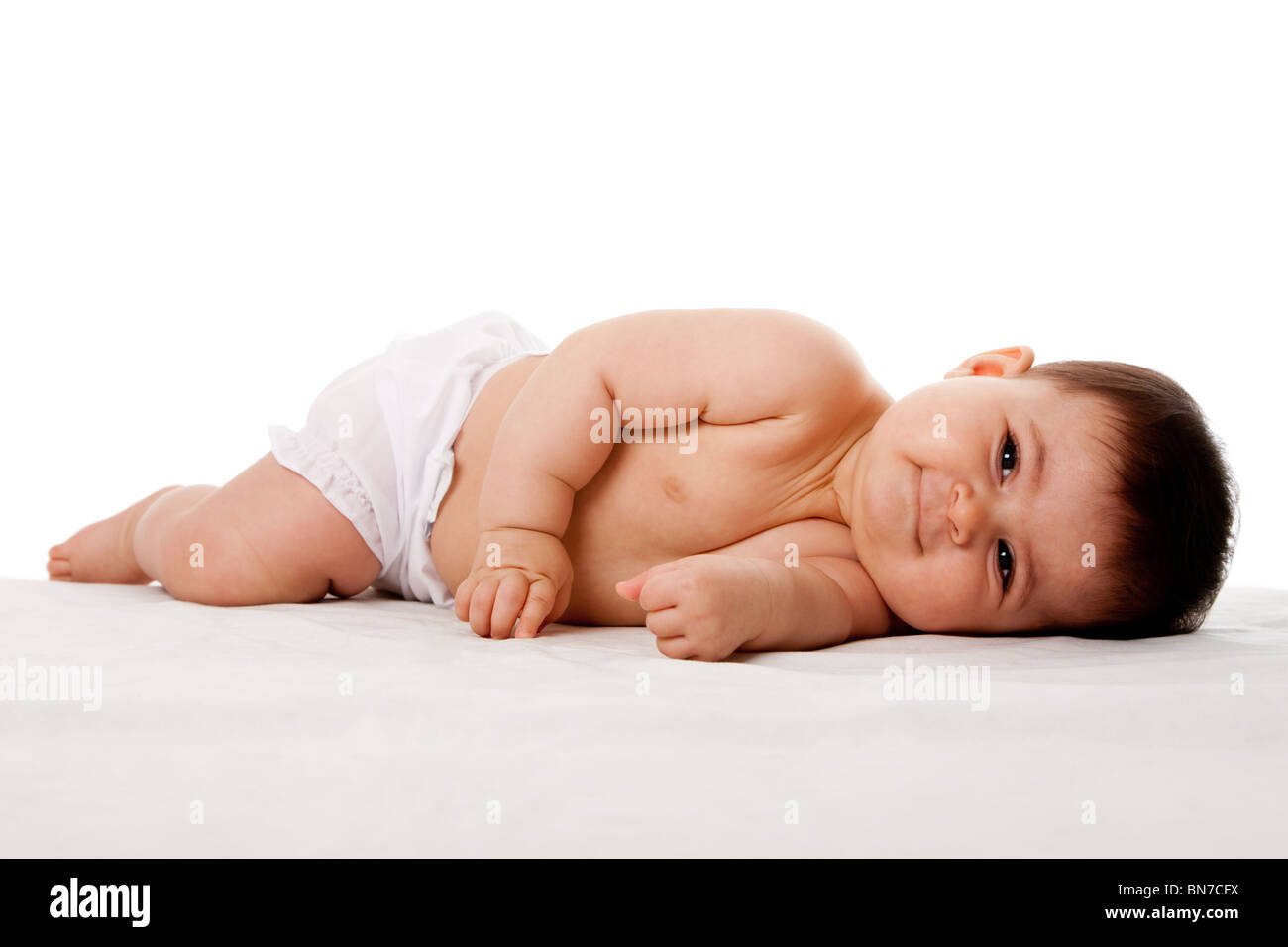 Beautiful cute peaceful tired happy baby laying on side, isolated Stock ...