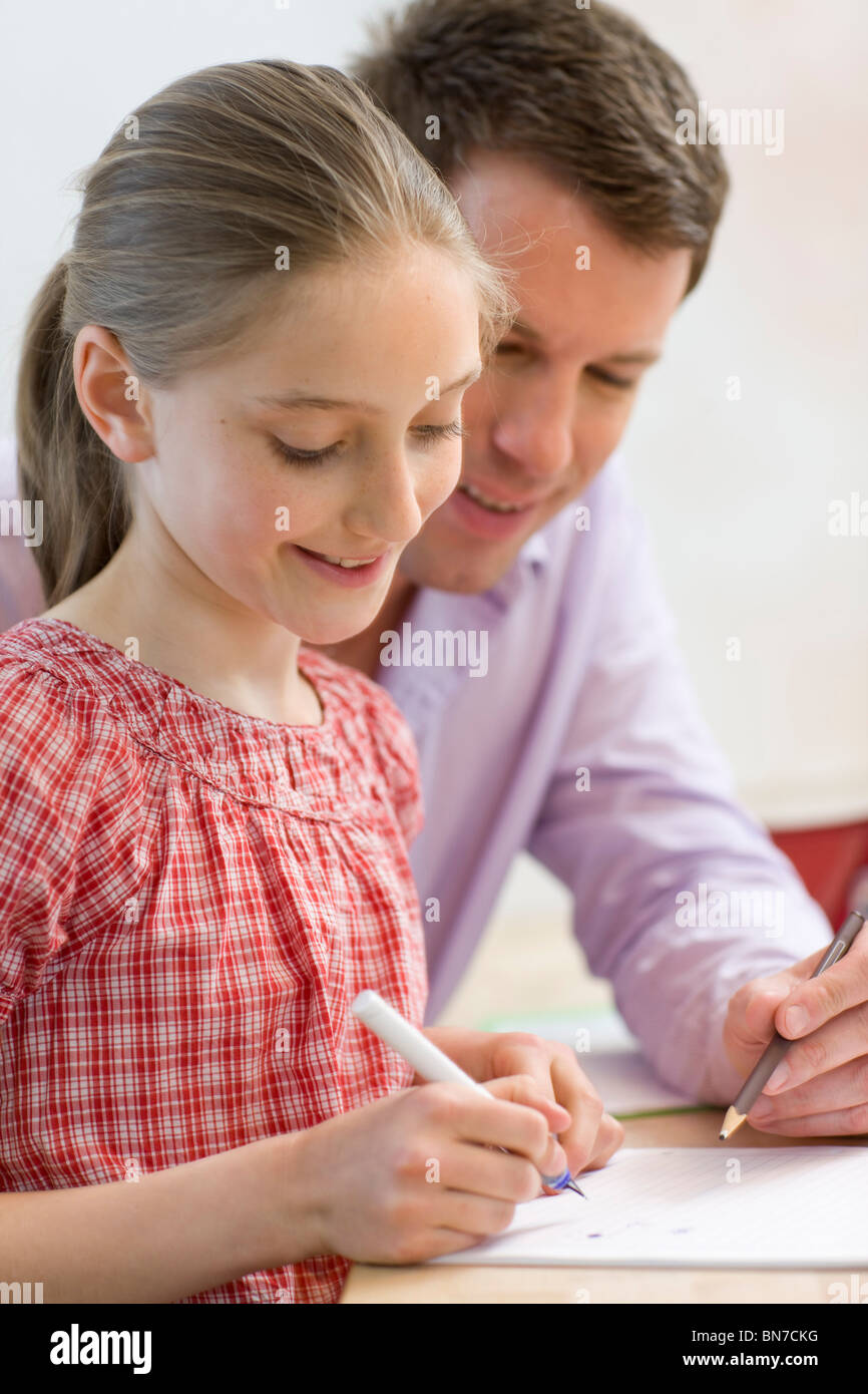 Father and daughter doing homework Stock Photo - Alamy