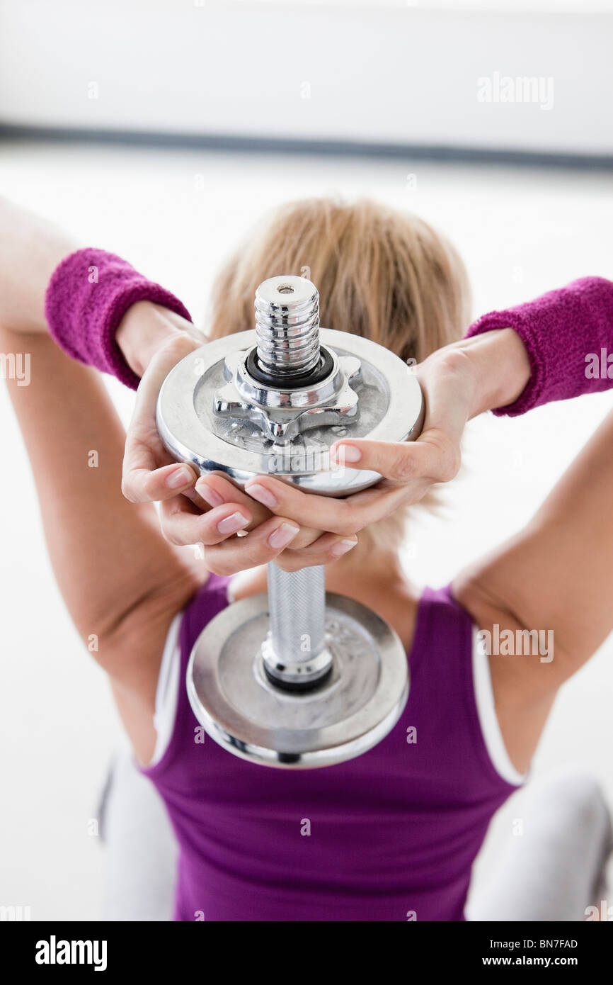 Woman with dumbbell training shoulders Stock Photo - Alamy