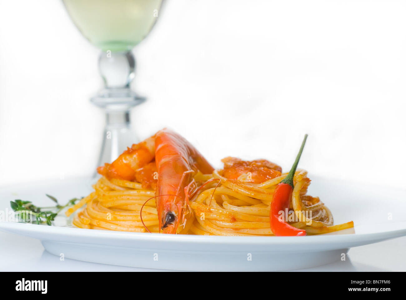 italian spaghetti pasta and fresh spicy shrimps sauce,with a grass of ...