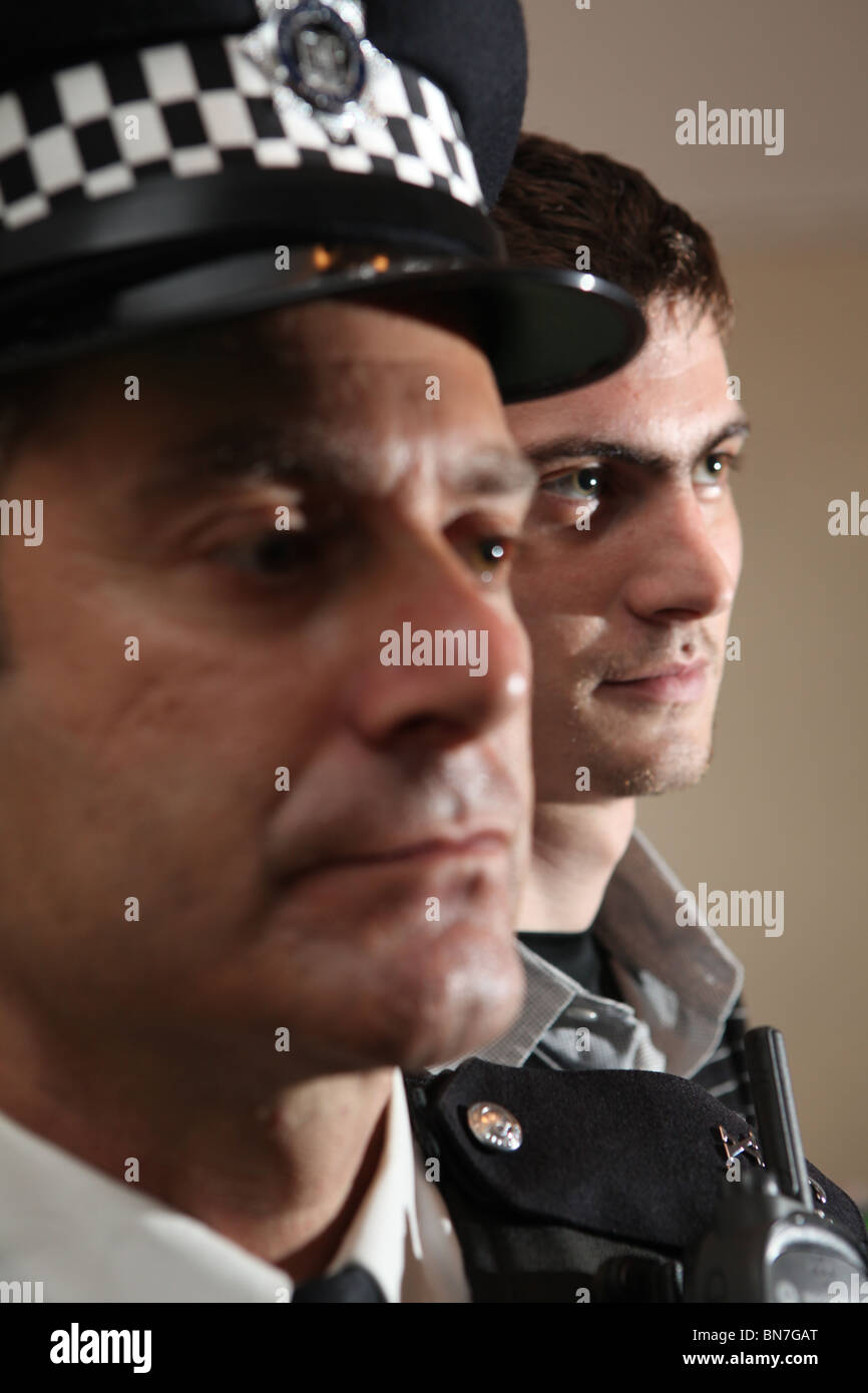 a portrait of a metropolitan police officer with a polish man stood ...