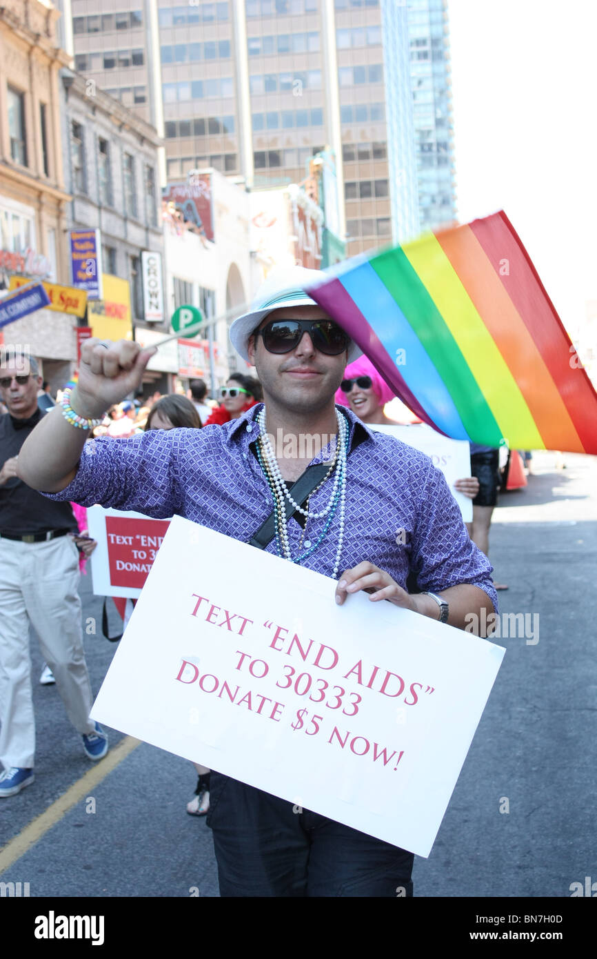 man holding pride flag AIDS sign Stock Photo - Alamy