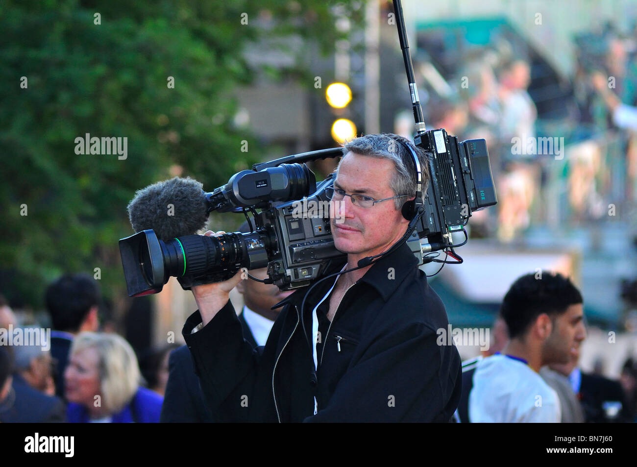 Camera man with a digital movie camera at Raavan premier, British Film ...