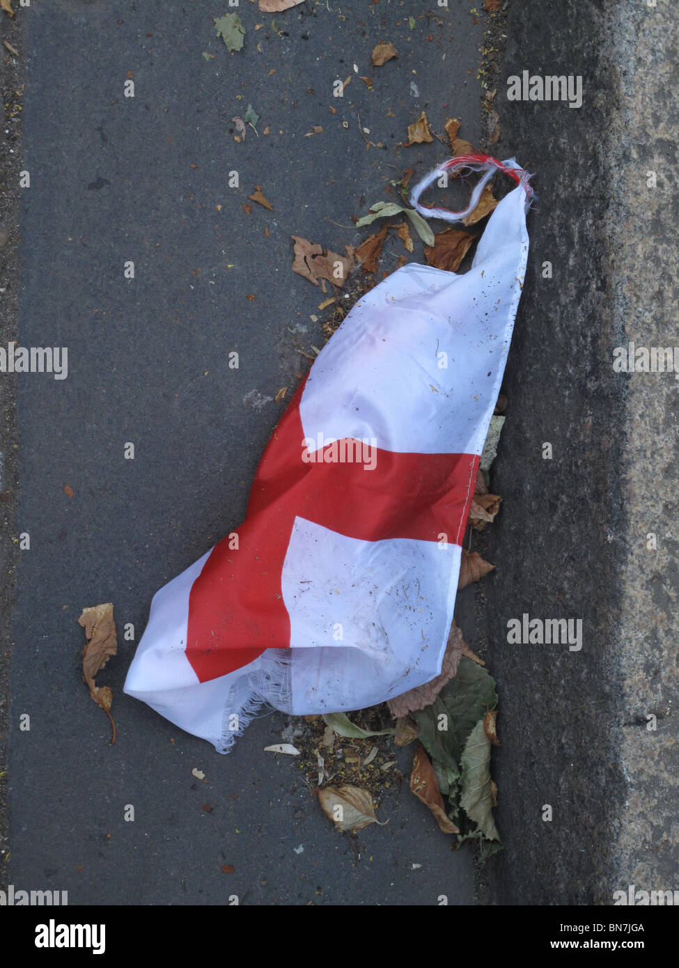 London July 2010.World cup England flag discarded in the gutter after ...