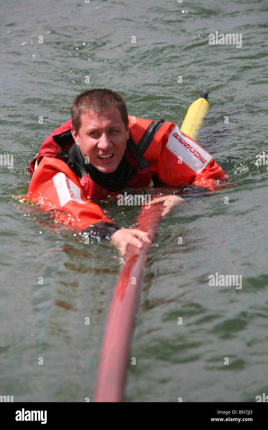 Fireman using hose hi-res stock photography and images - Alamy