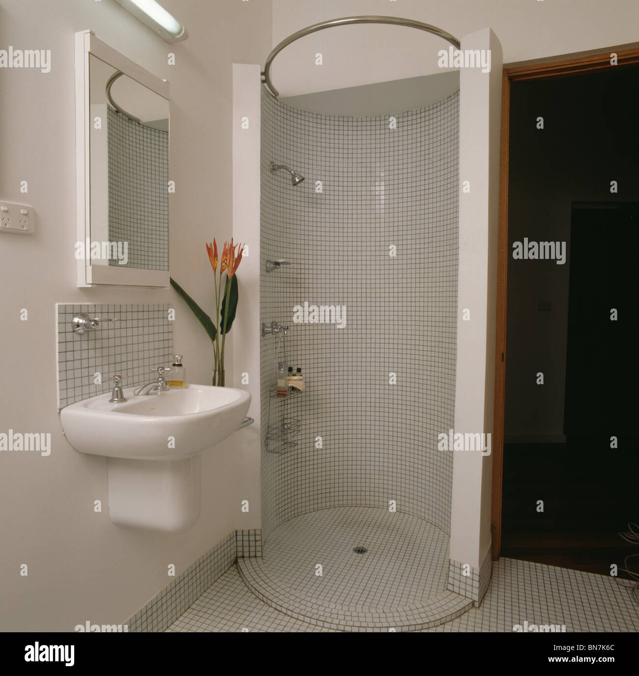 Mosaic tiled walk-in circular shower cabinet in modern white bathroom ...