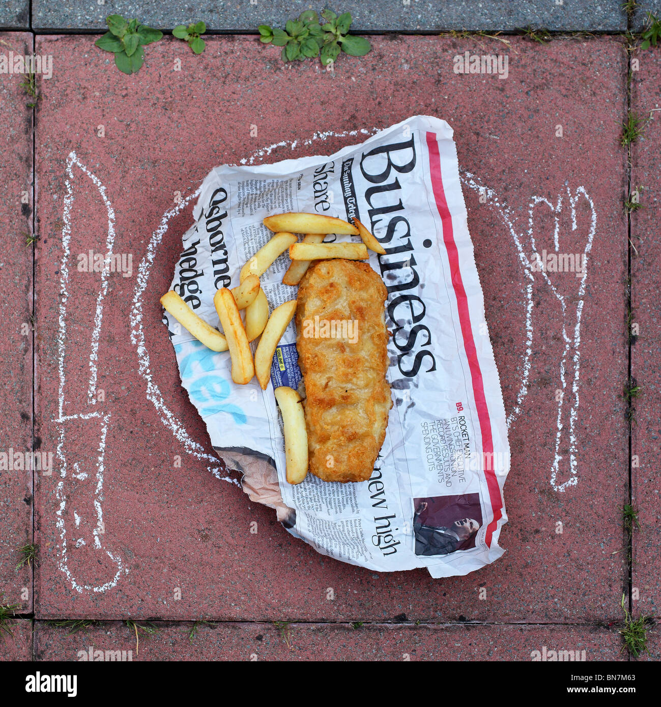 English fish chips served news paper Stock Photo - Alamy