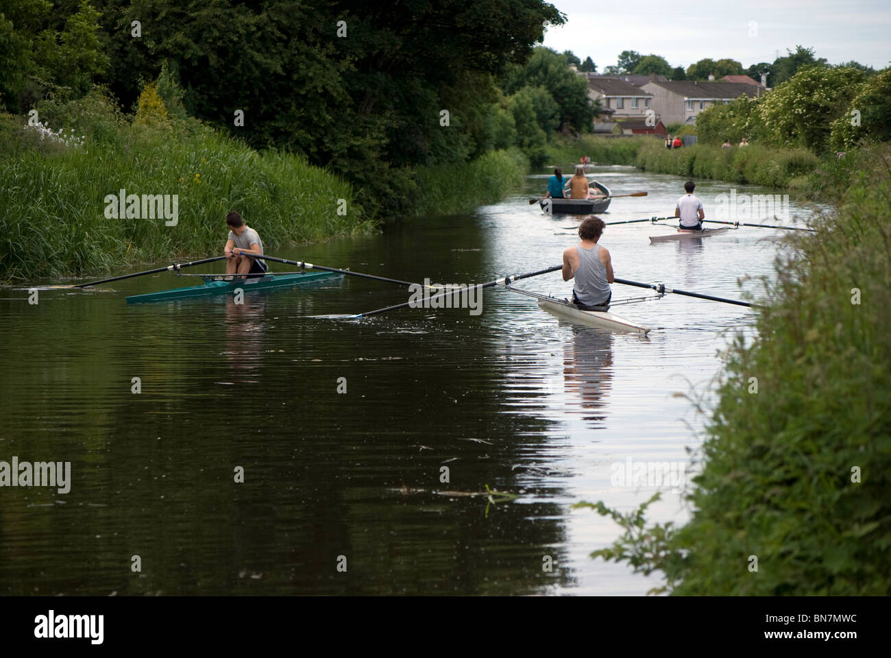 Men rowing sports rowing boats on the Union Canal, Edinburgh, Scotland ...