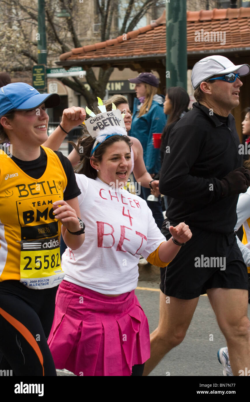 Girl wearing cheerleader outfit with tiara that reads, "Cheer For Beth ...