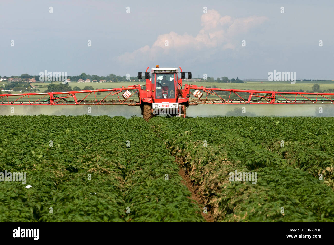 Crop Spraying by tractor kent countryside england uk Stock Photo - Alamy