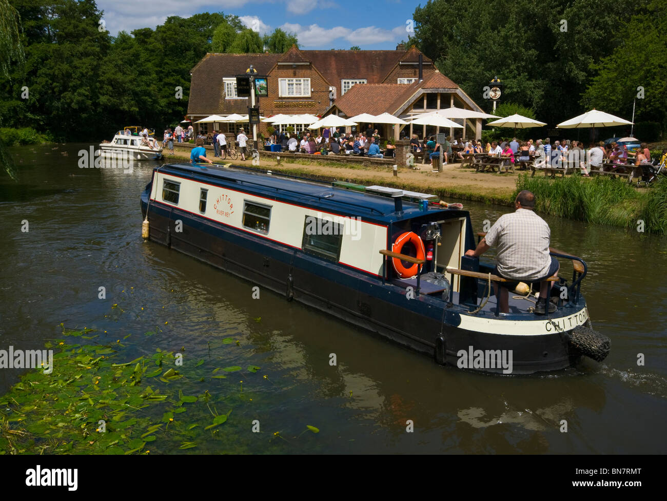 Narrowboat cruising on canal hi-res stock photography and images - Alamy