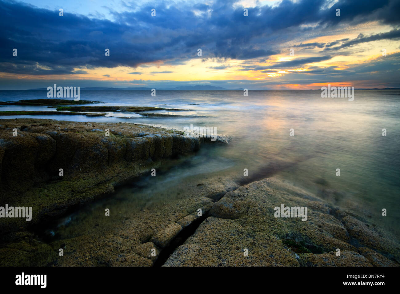 Ballast bank coastal sunset, Troon, Ayrshire Stock Photo - Alamy