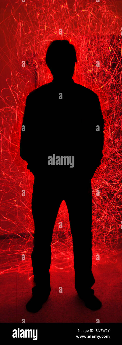 Silhouette man behind red fire hi-res stock photography and images - Alamy