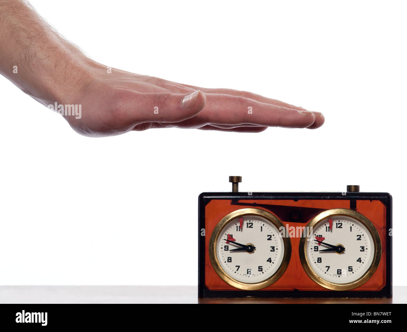 hand pushing chess clock Stock Photo - Alamy