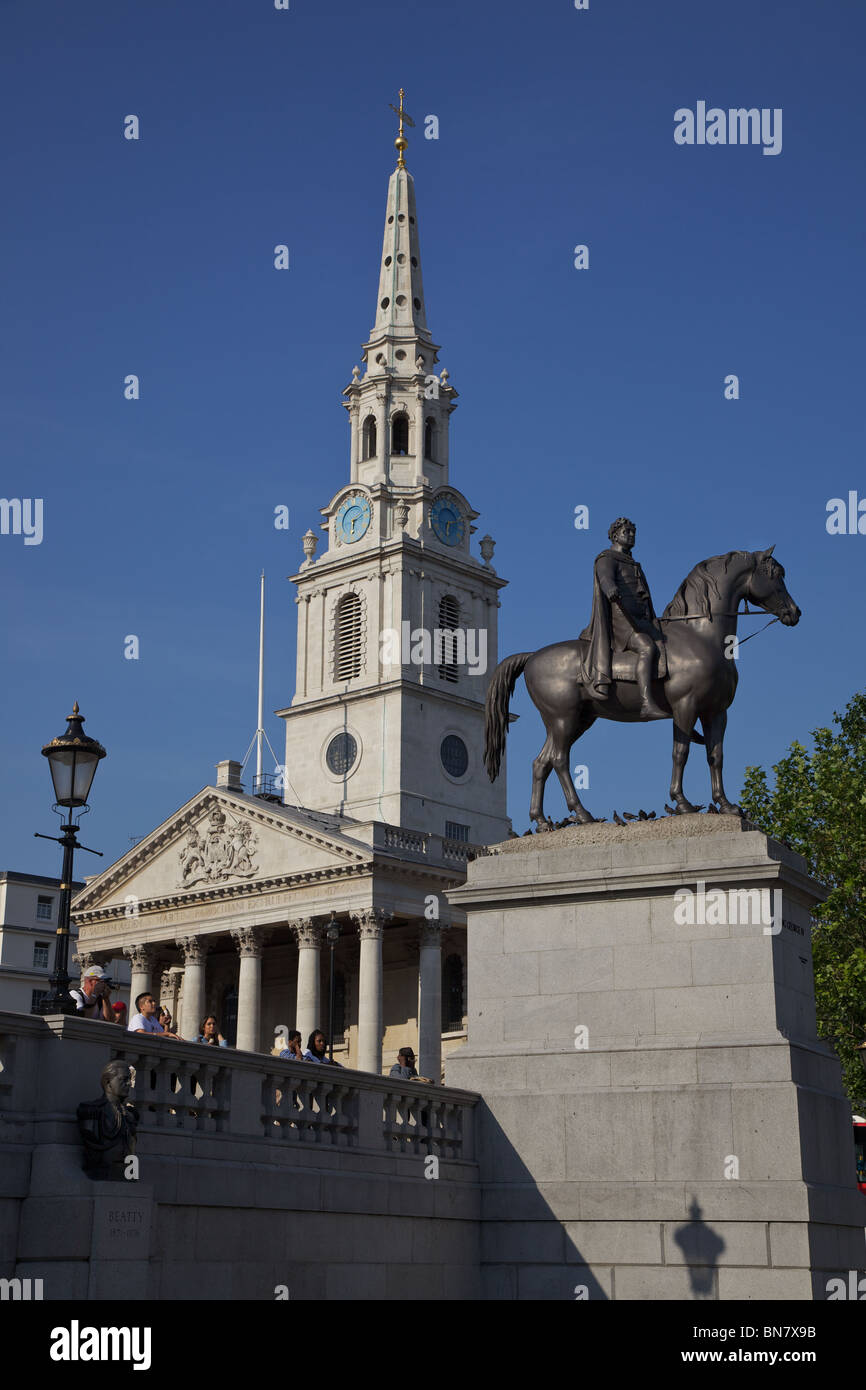 Statue of King George 1V in Trafalgar Square London, with St Martins in ...