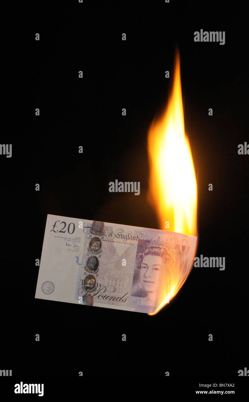 Burning £20 note Stock Photo - Alamy