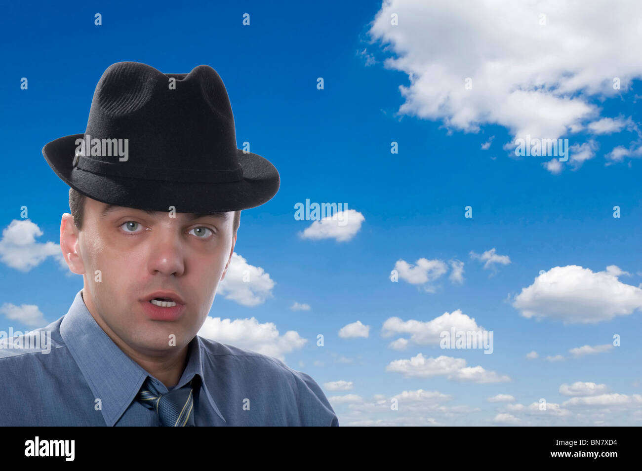 people on blue sky - men on hat Stock Photo - Alamy