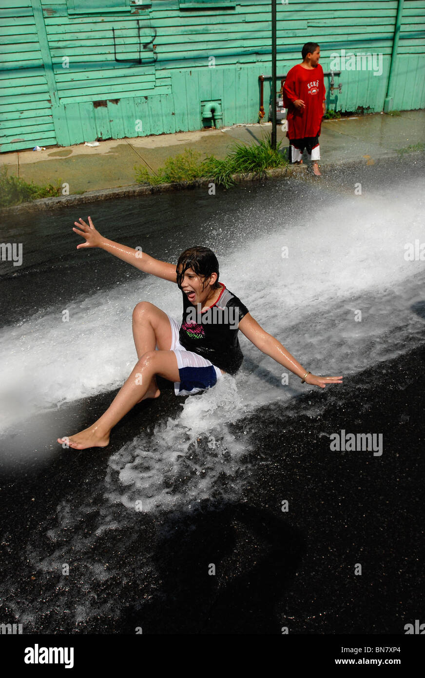 Kids playing fire hydrant hi-res stock photography and images - Alamy