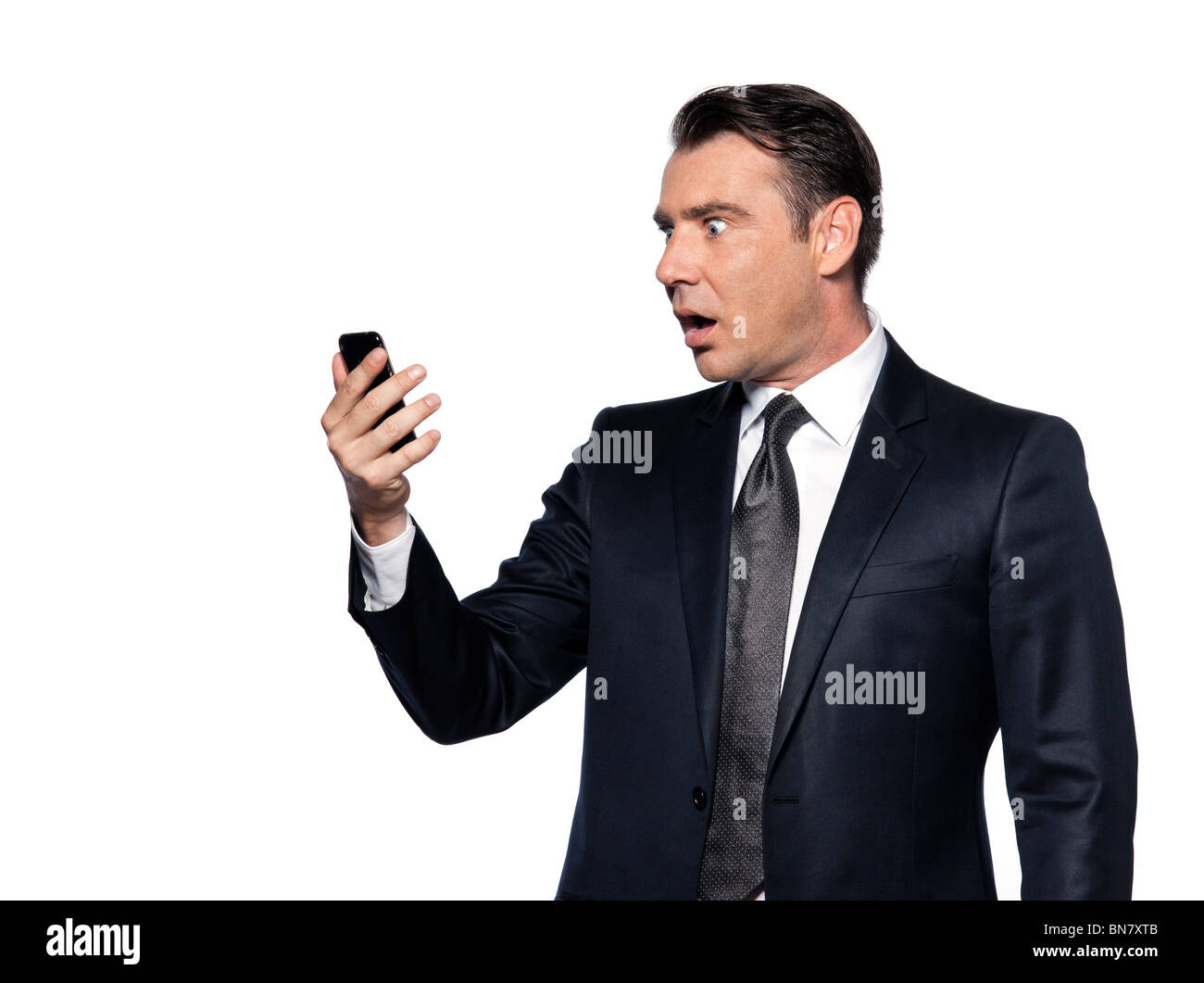 handsome caucasian man looking at phone stun portrait isolated studio ...