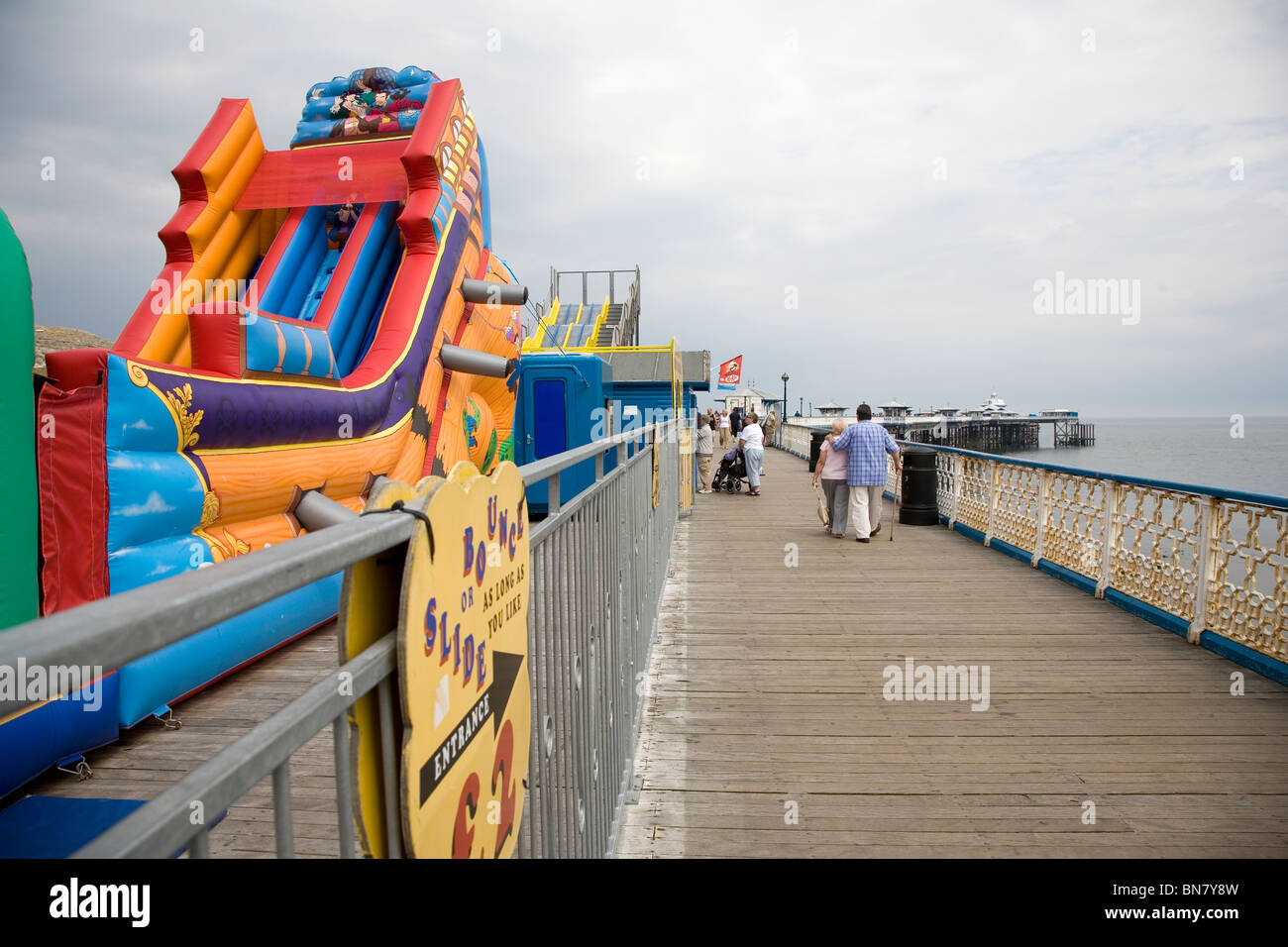 children's rides bouncy castle llandudno pier wales uk Stock Photo - Alamy