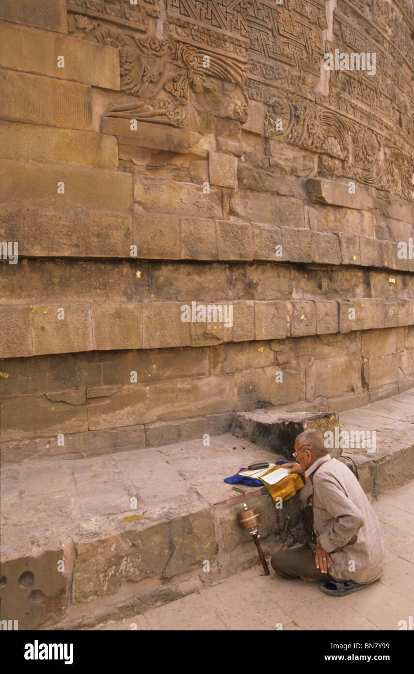 Buddhist pilgrim at prayer Dhamekh Stupa ancient site of Sarnath holy ...