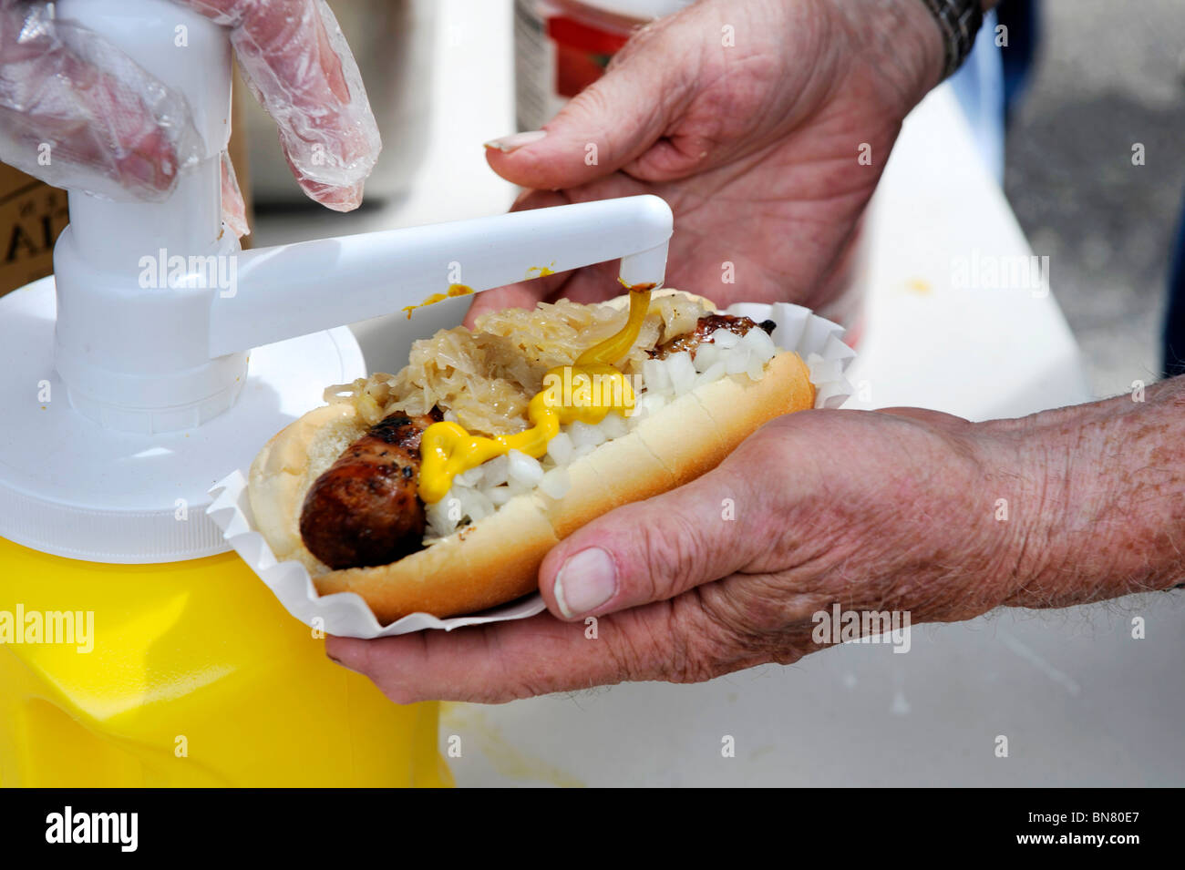preparing hot dog for eating Stock Photo - Alamy