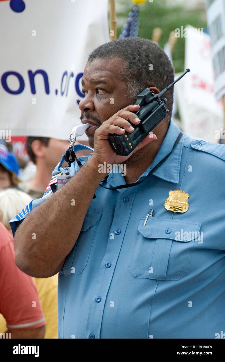 Police Officer communicates at protest rally demonstration Stock Photo ...