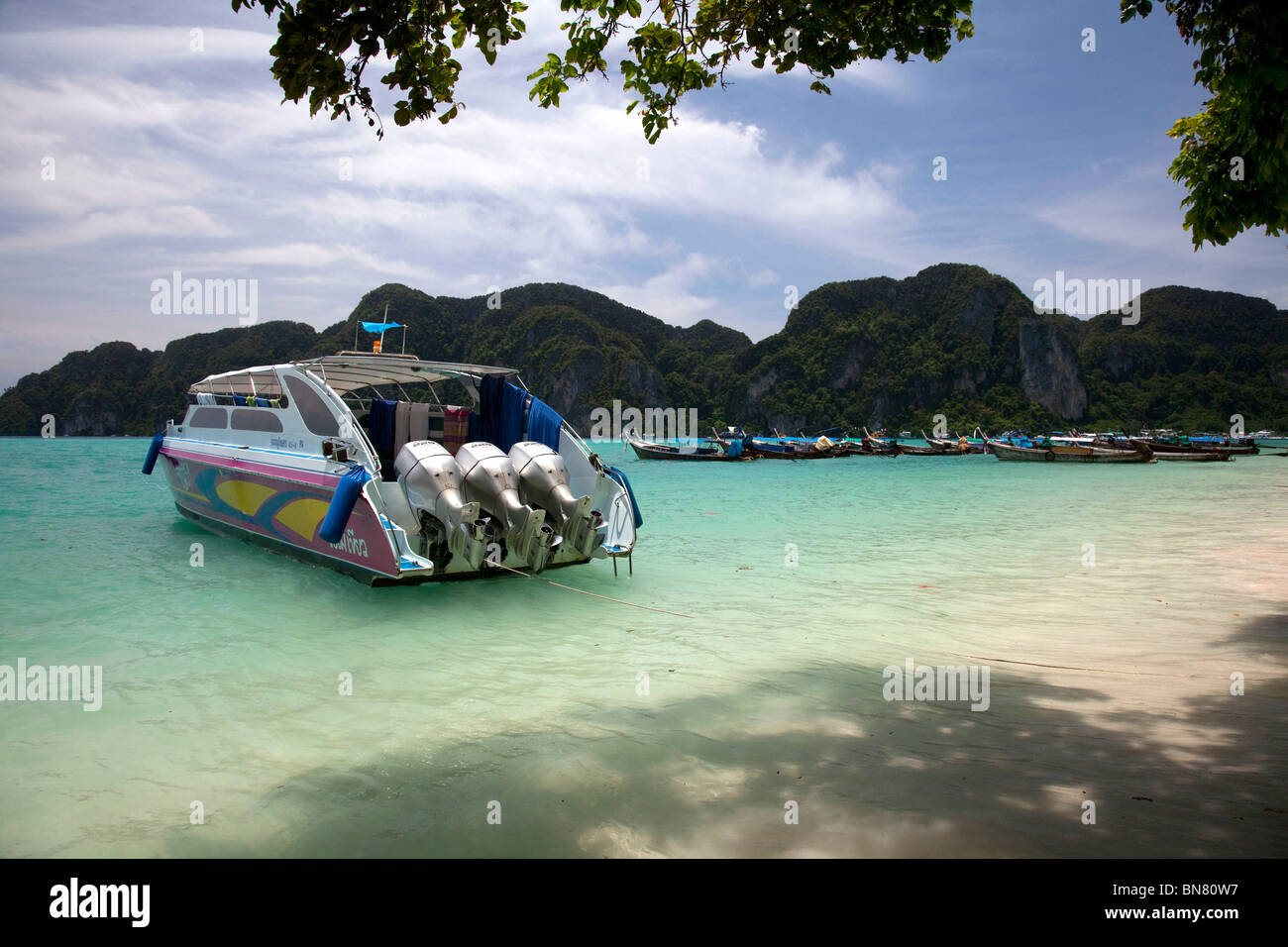 A seed boat moored in an idyllic bay, Phi Phi Islands, Thailand Stock ...