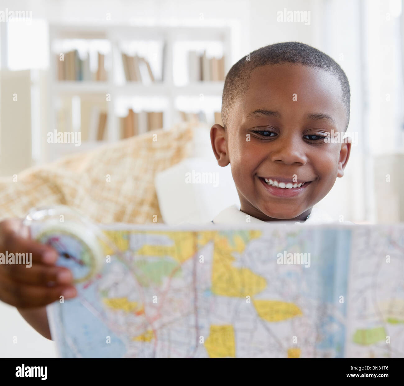 Black boy looking at map Stock Photo - Alamy