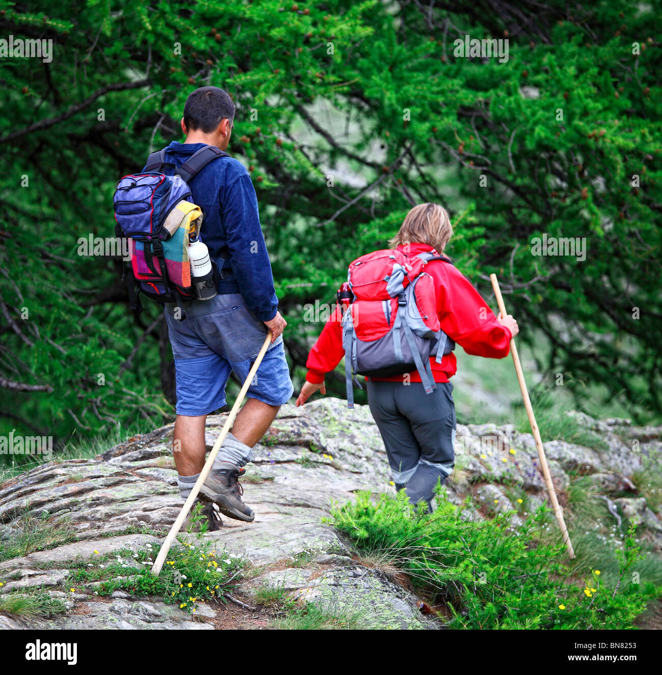 caucasian couple trekking in mountain path Stock Photo - Alamy