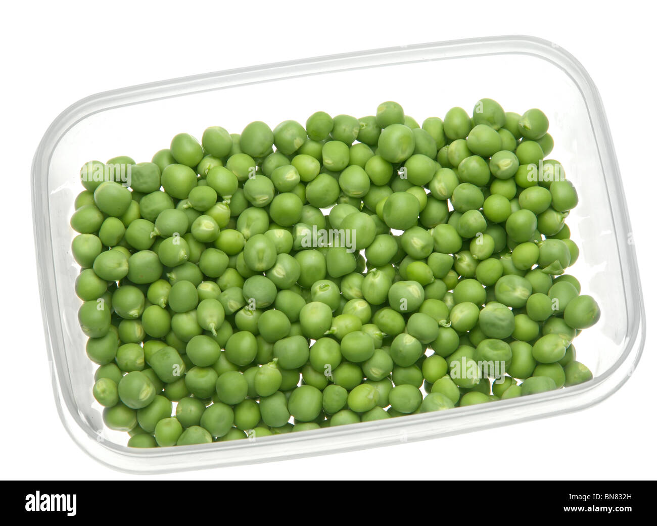 Peas green seed in plastic box on white Stock Photo - Alamy