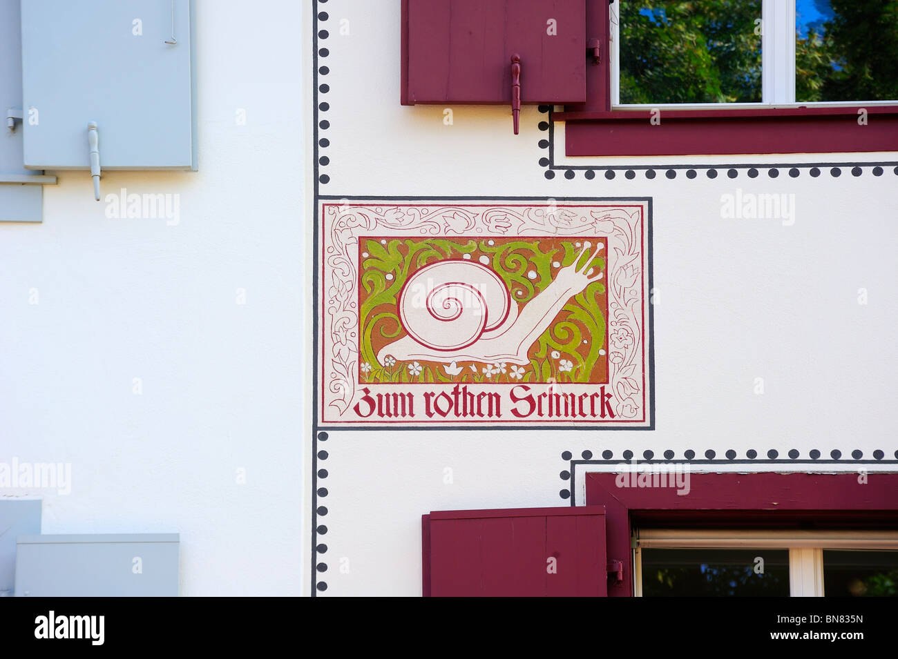 The Red Snail - a house-sign in Basel, Switzerland Stock Photo - Alamy