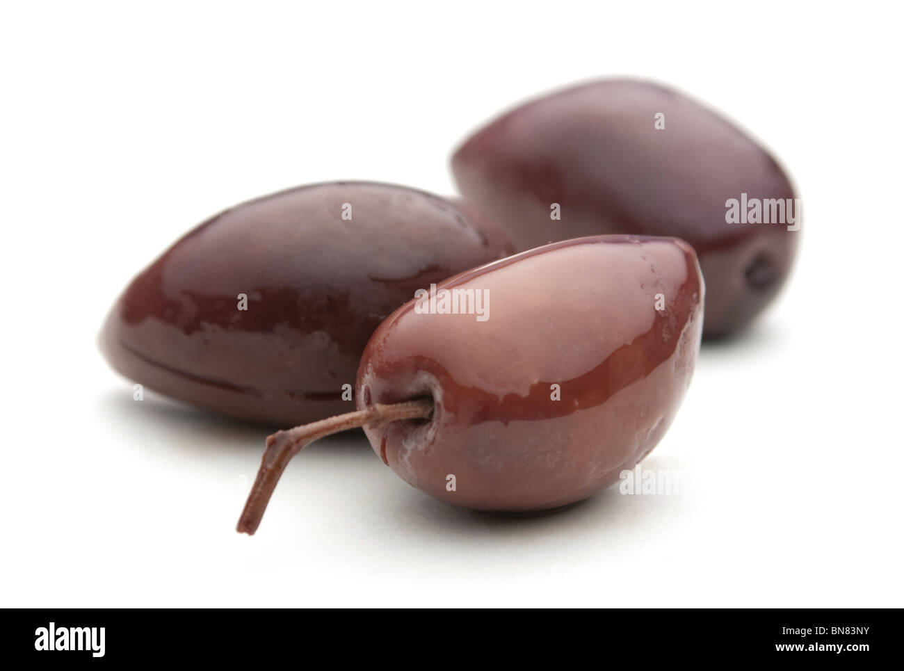 Brown olive vegetable closeup on white background Stock Photo - Alamy